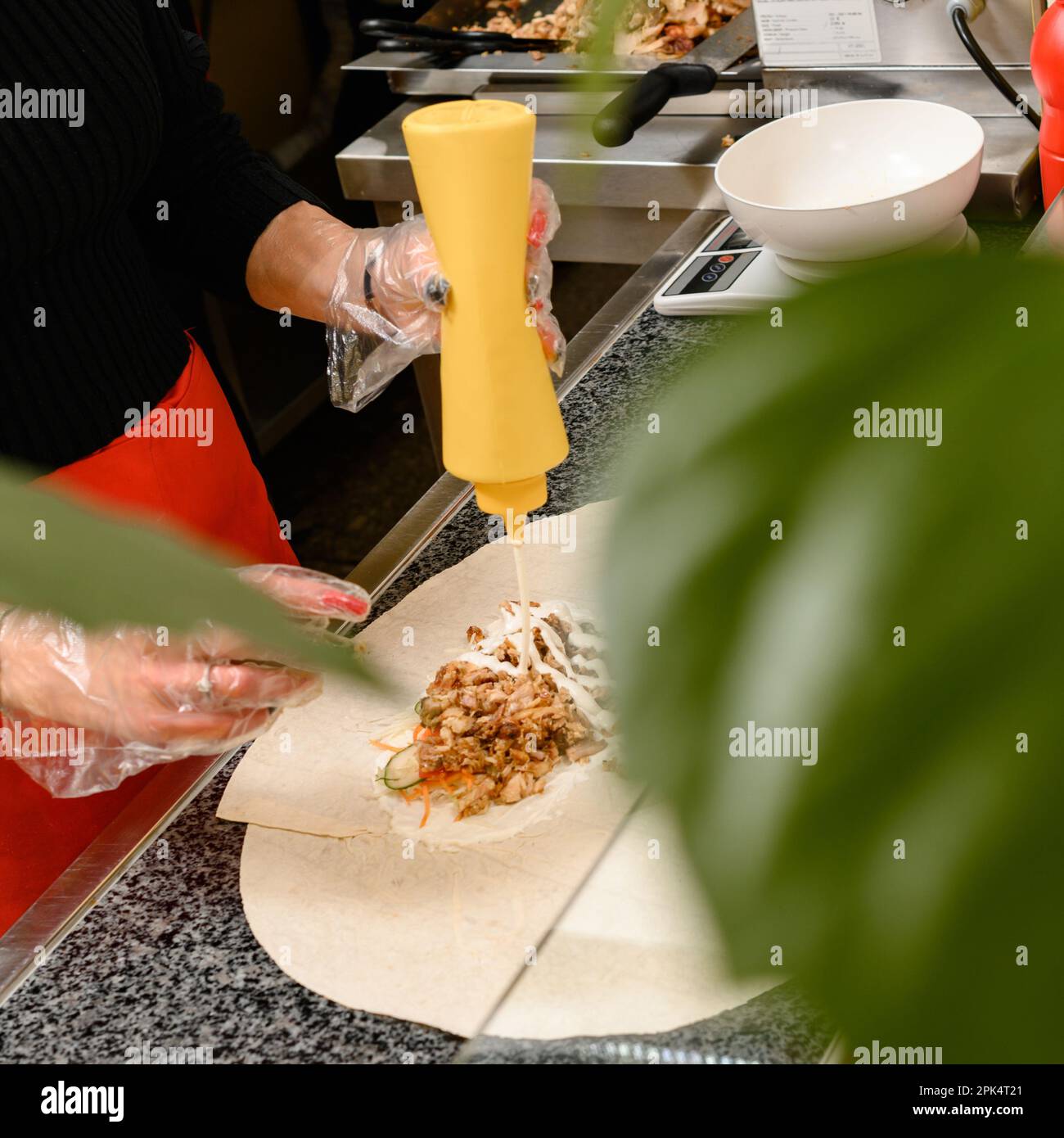 Shawarma preparation in a fast food restaurant, vegetable and meat ...