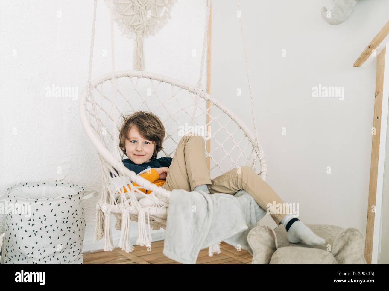Kid sitting in chair hi-res stock photography and images - Alamy