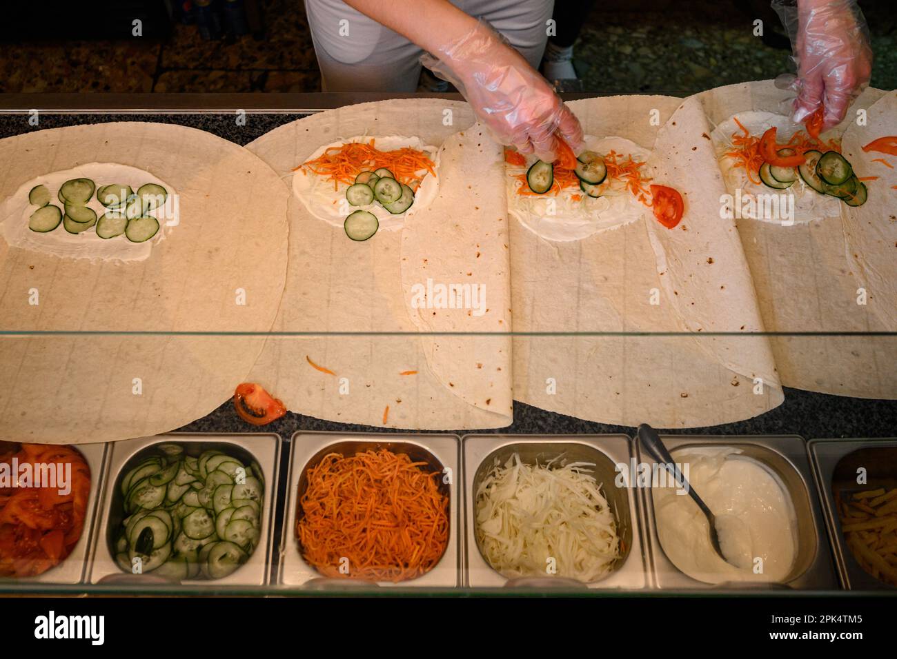 Shawarma preparation in a fast food restaurant, vegetable and meat ...