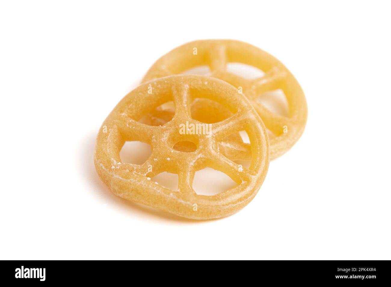 Uncooked Wheel Fryums Isolated on a White Background Stock Photo - Alamy