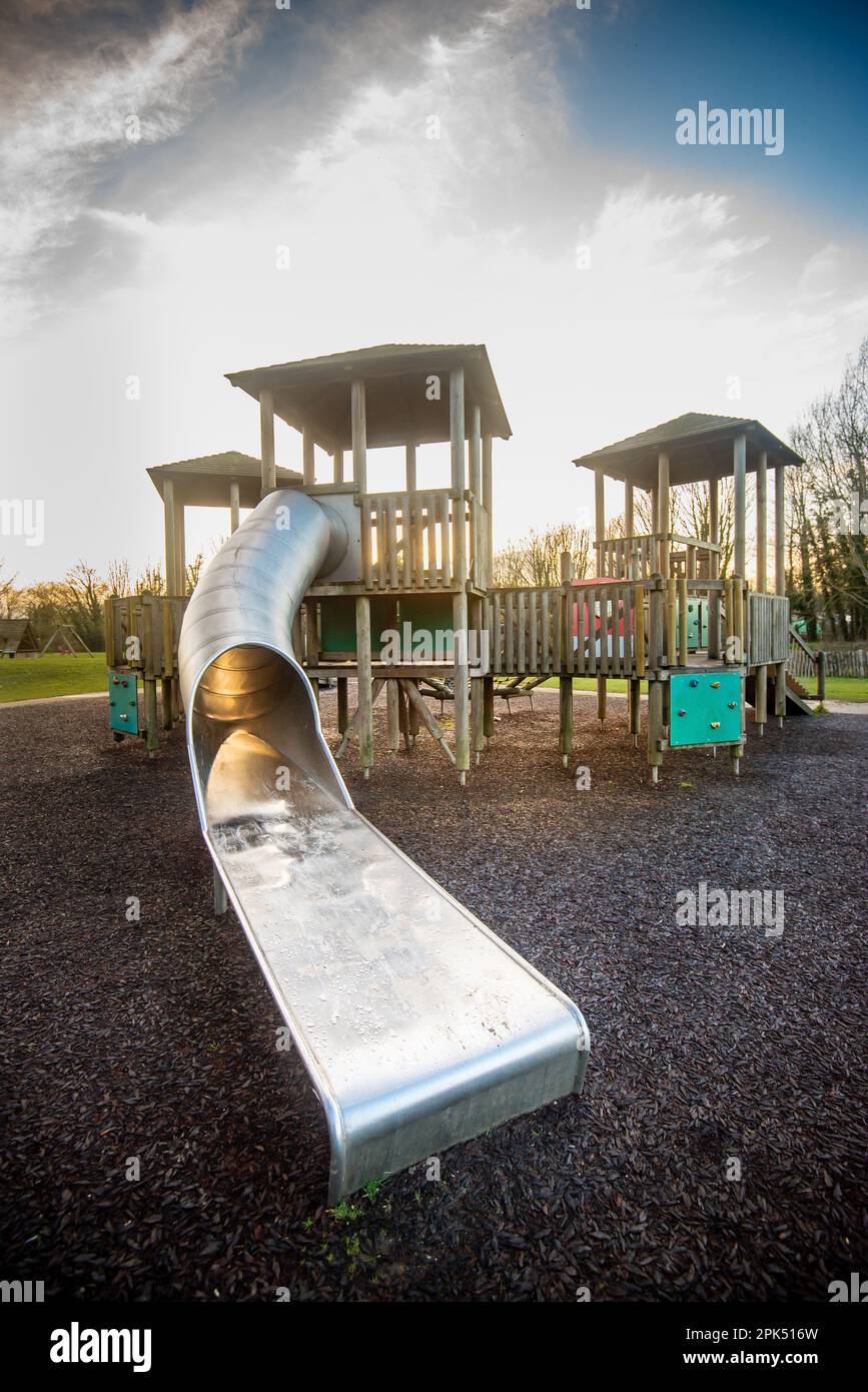 Children's playground wooden play structure fort with large metal slide ...