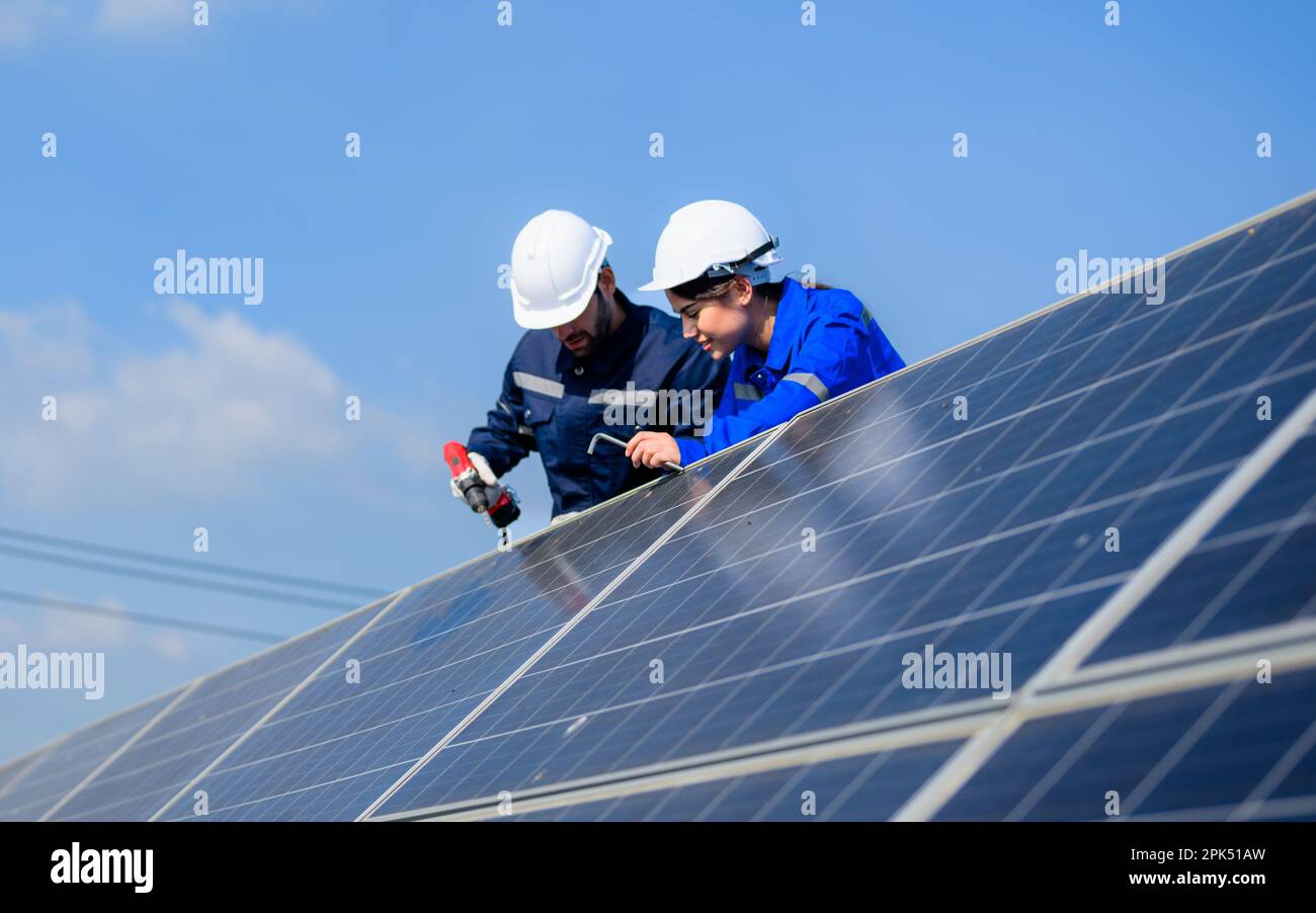 Technicians workers team installing solar panels at industrial solar ...