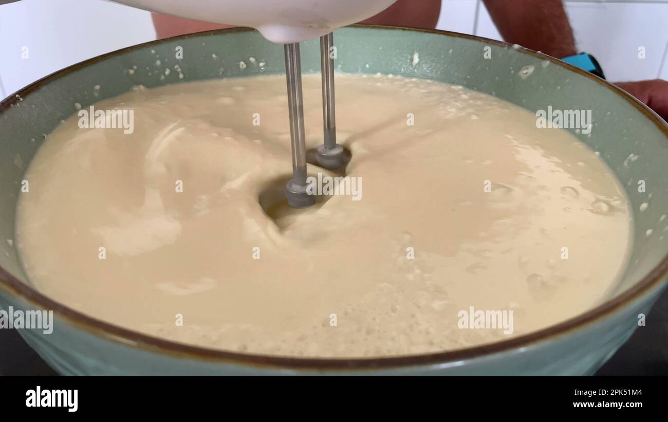 Baker mixed flour hand mixer hi-res stock photography and images - Alamy