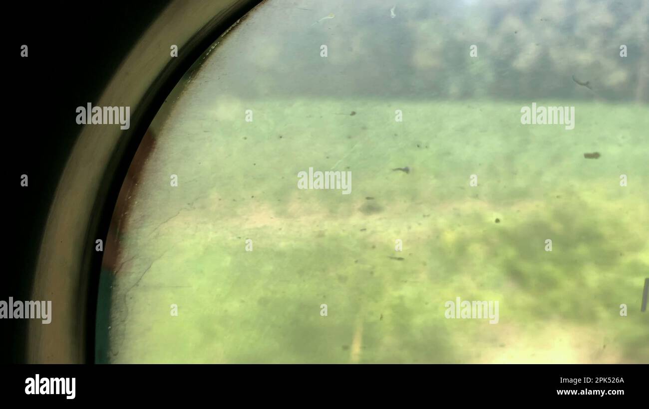 Grungy dirty train window travelling on journey passing landscape Stock ...