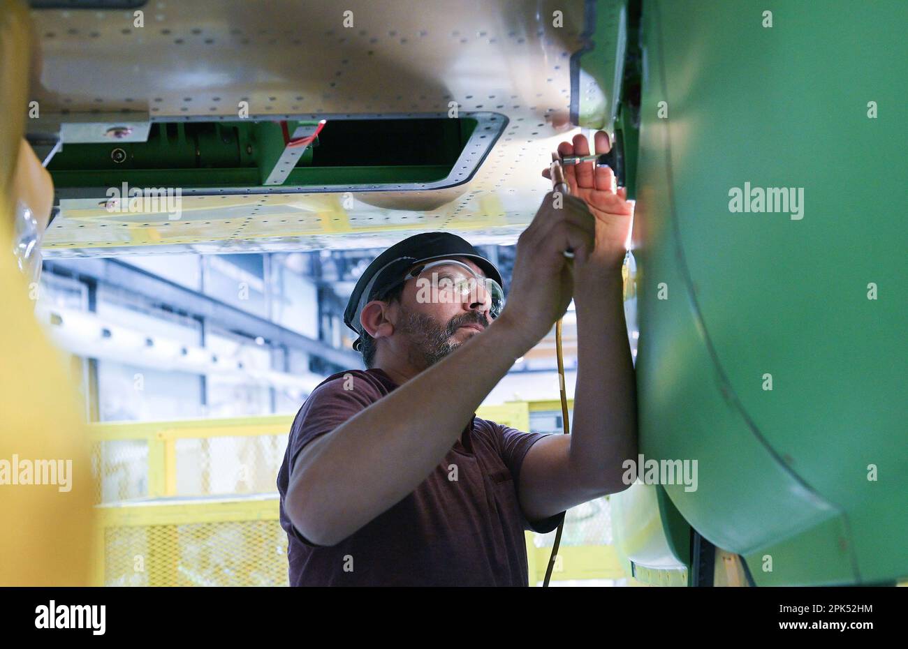 Montreal, Canada. 05th Apr, 2023. A man is shown working on the wing of ...