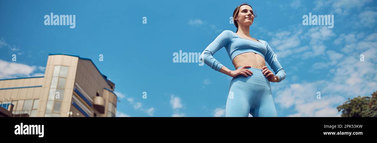 Beautiful fit young woman jogger is running outdoors Stock Photo - Alamy