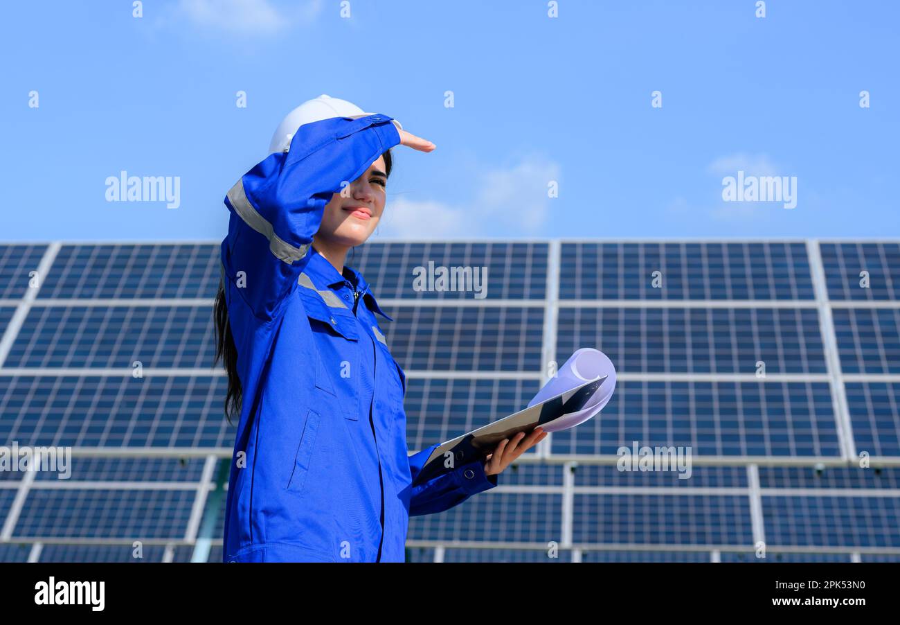 Engineer worker portrait with solar panel at solar farm Stock Photo - Alamy
