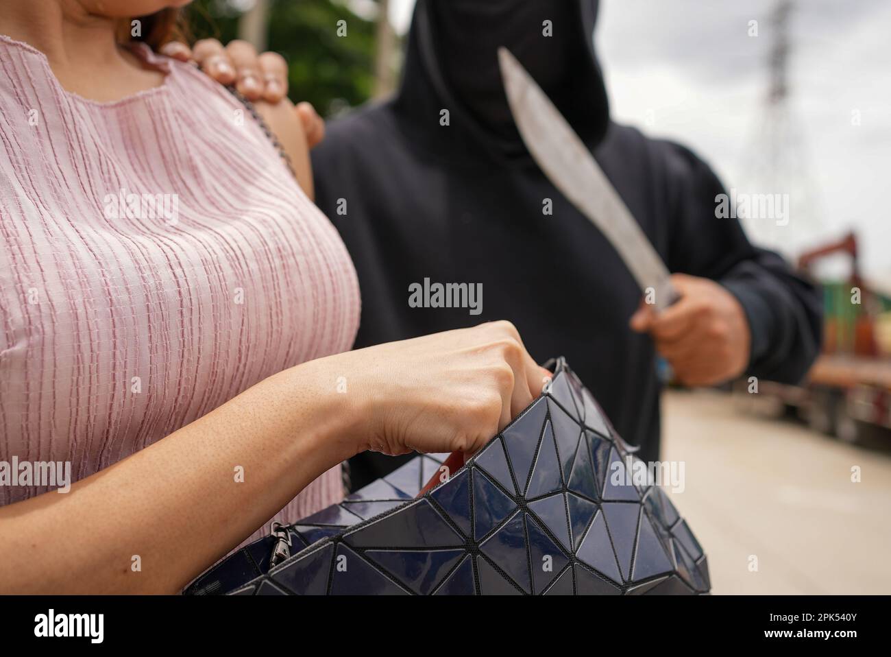 Man robbed woman, Thief stealing in public Stock Photo - Alamy