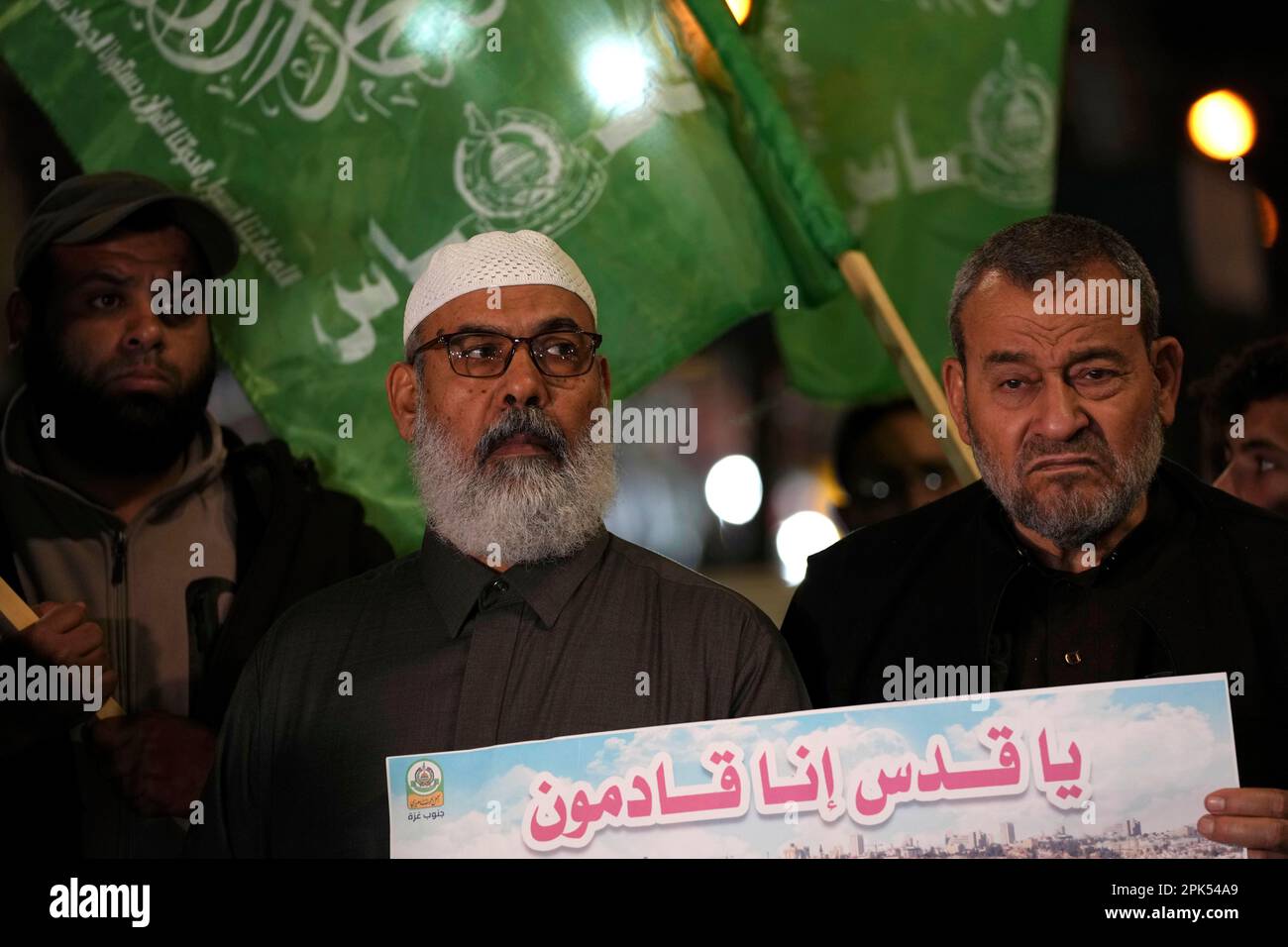 Hamas supporters wave green Islamic flags during a protest against an ...