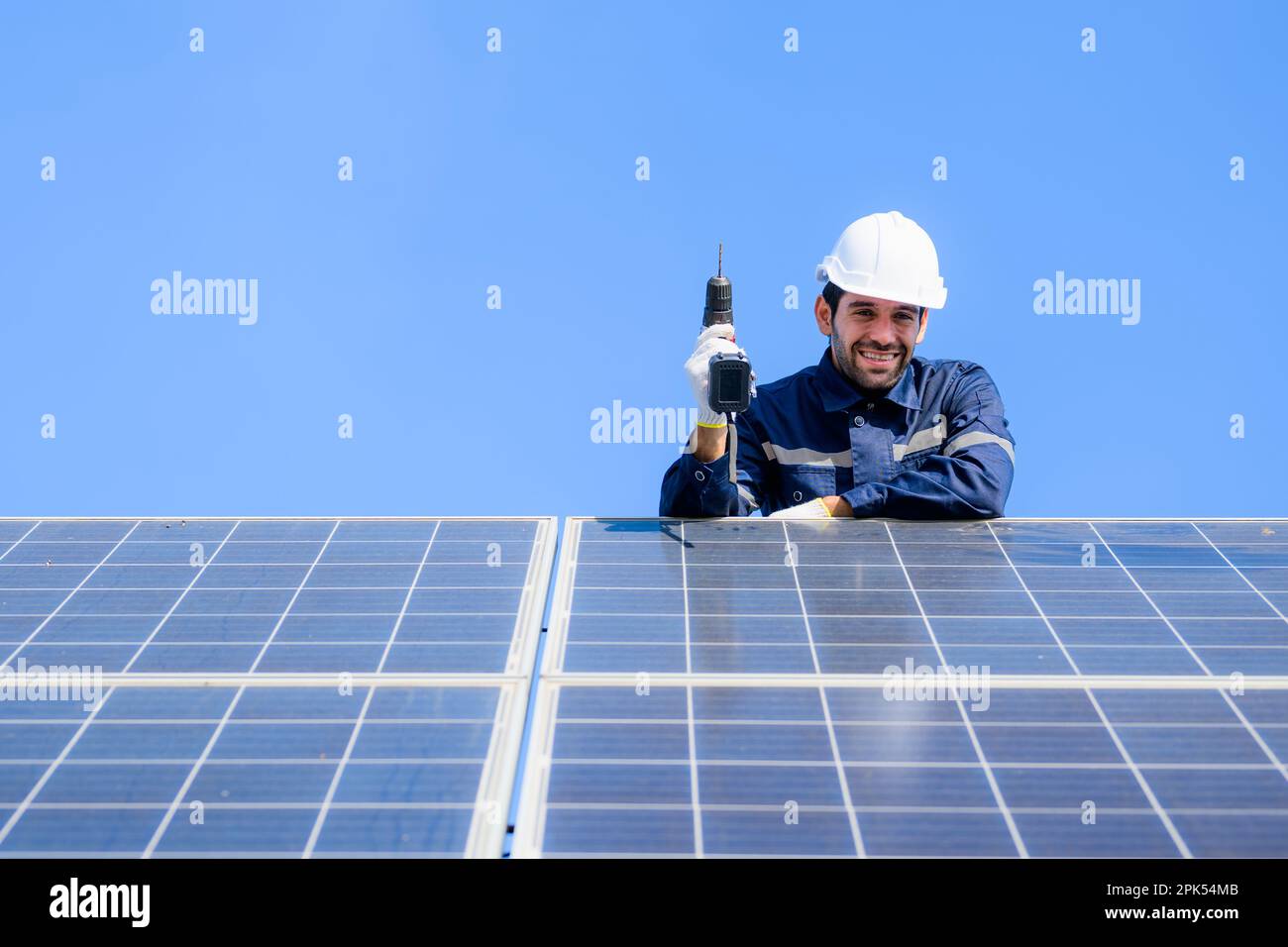 Technician worker installing solar panels at solar cell farm Stock ...