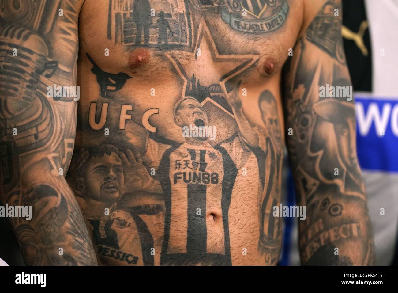 A detailed view of a tattooed Newcastle United fan in the stands during ...