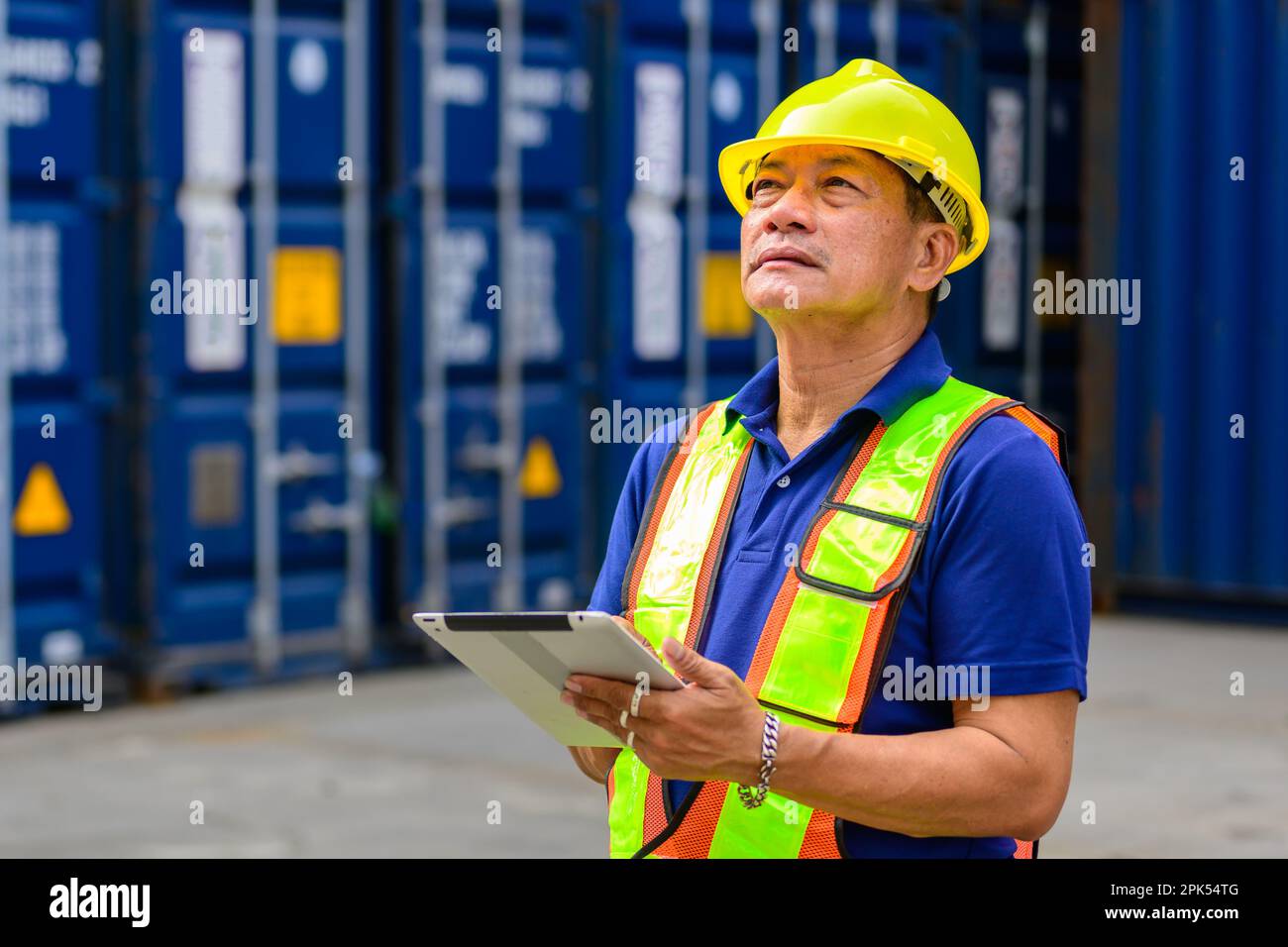 Warehouse engineer worker checking and working at industrial container ...