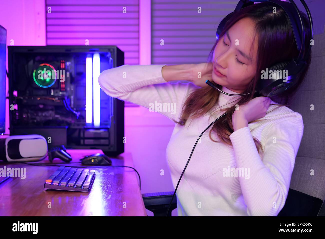 Female gamer having eye strain and headache after lose game Stock Photo ...