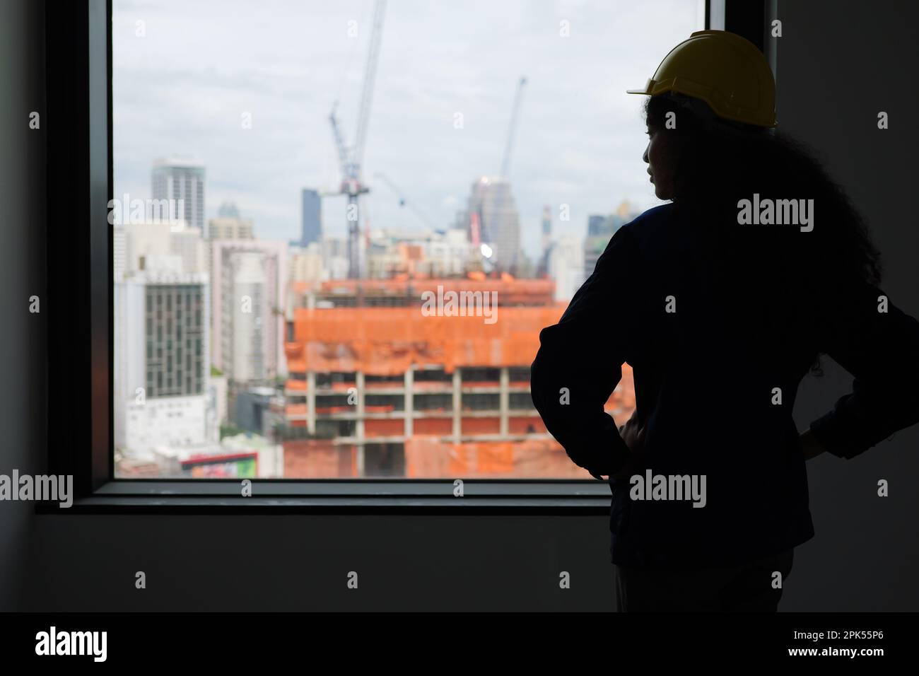 Portrait of engineer foreman with safety helmet and vest on building ...
