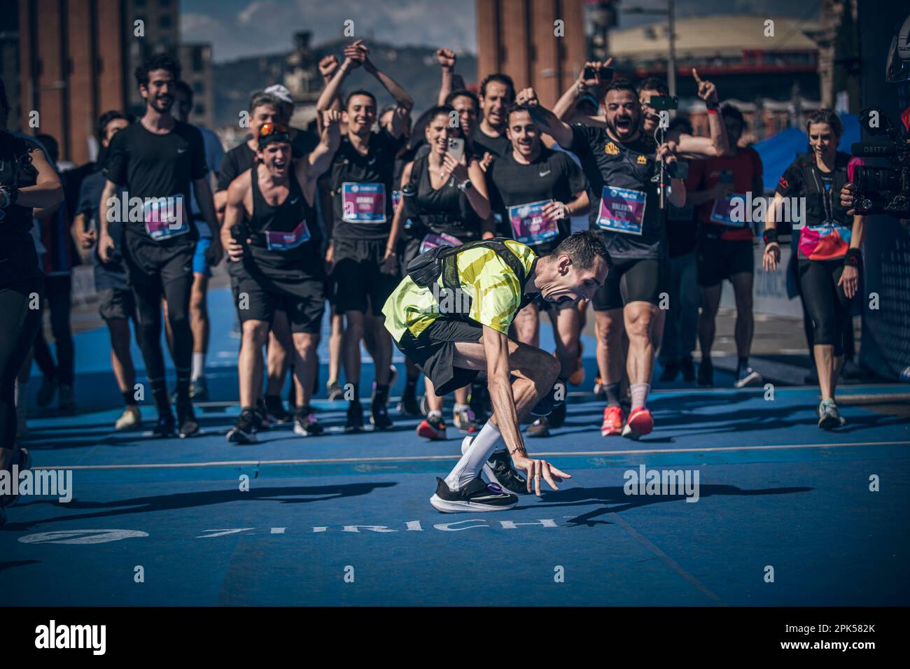 Alex Roca reaching the finish line in his first Barcelona marathon and ...
