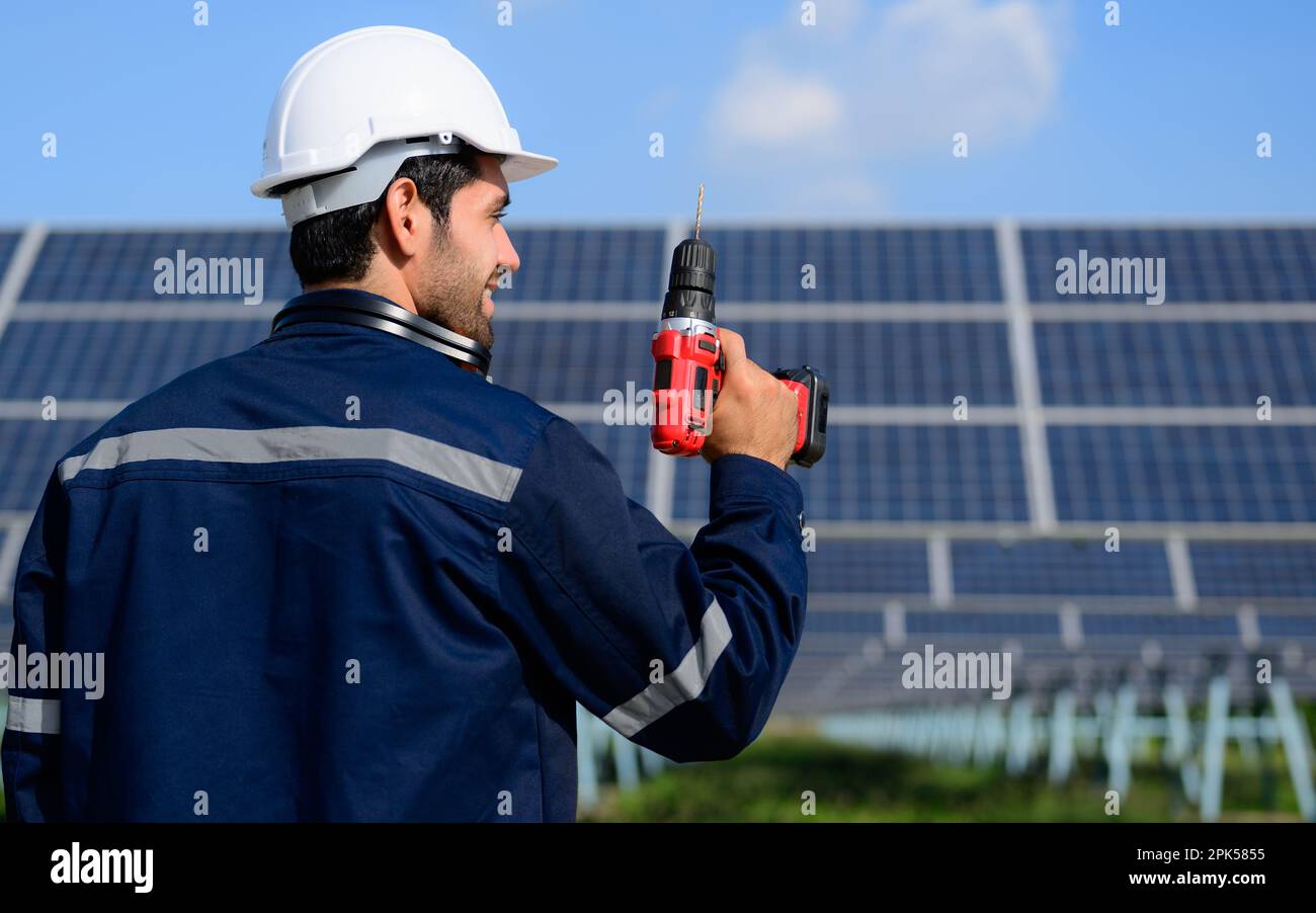 Technician worker installing solar panels at solar cell farm Stock ...