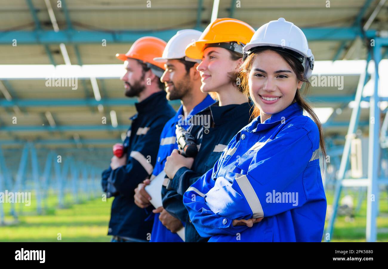 Group of technicians engineers with arm crossed standing at solar cell ...
