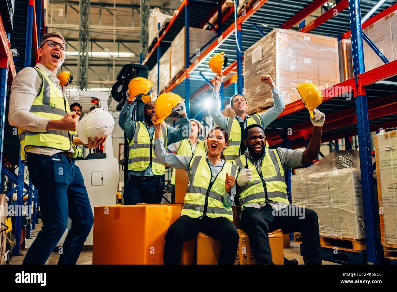 Professional warehouse worker team celebrating success in warehouse factory Stock Photo - Alamy