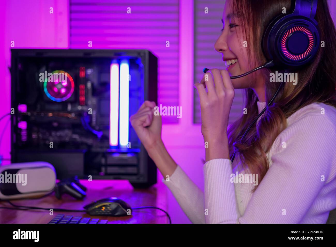 Excited young woman gamer wearing hi-res stock photography and images ...