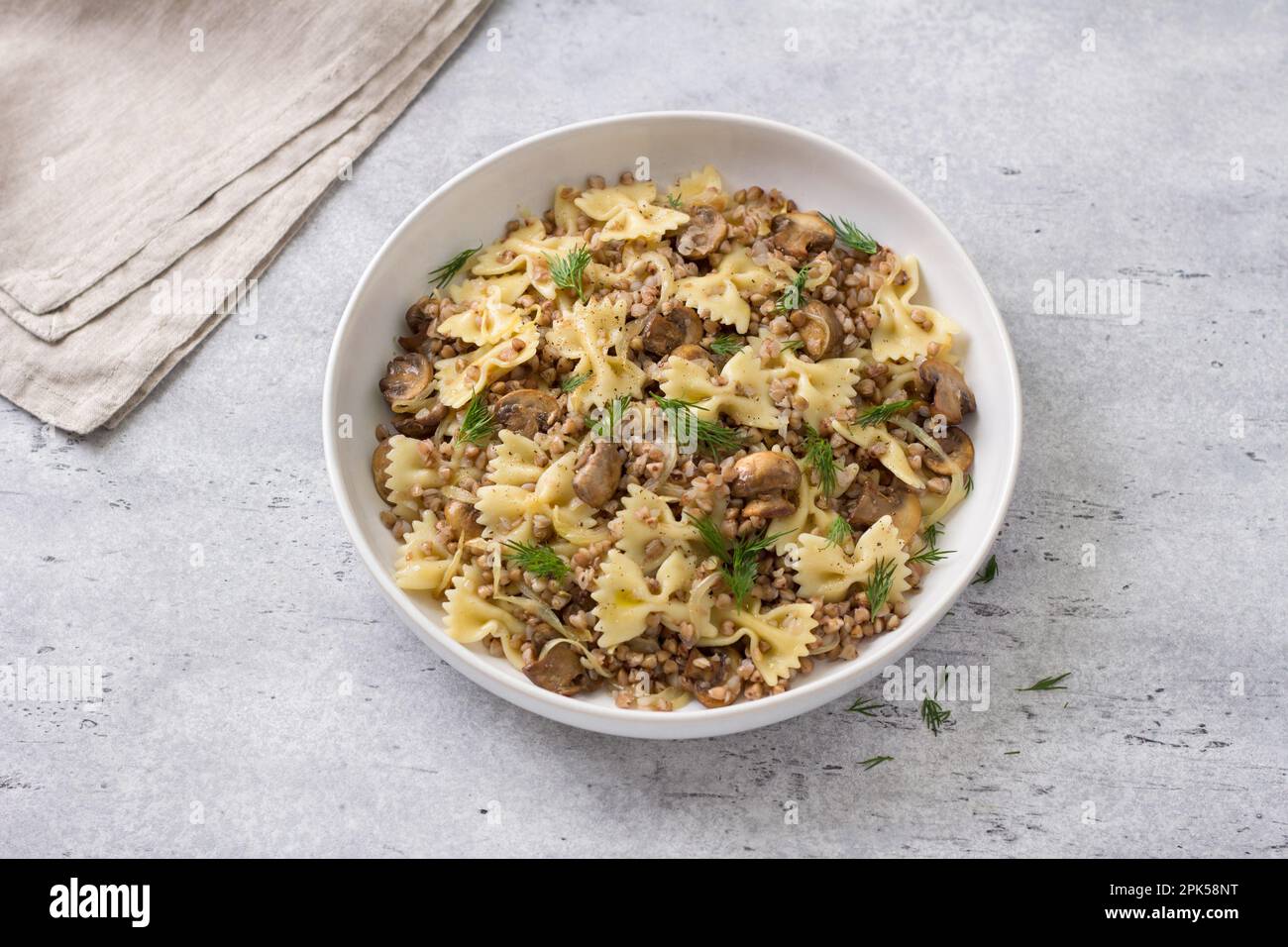 Traditional Jewish dish kasha varnishkes: buckwheat, pasta, champignon ...