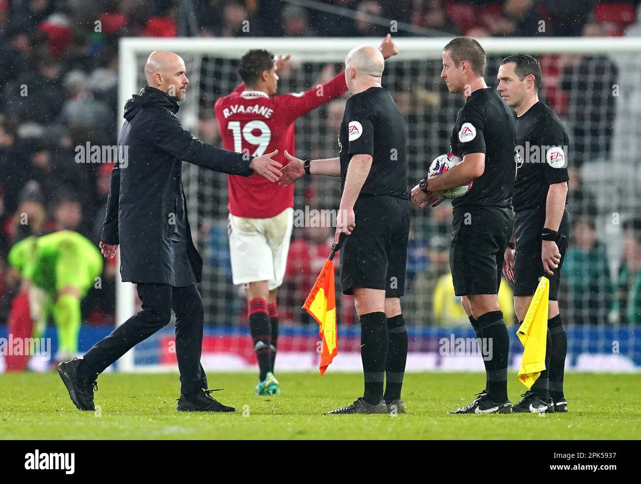 Manchester United manager Erik ten Hag (left) shake hands with ...