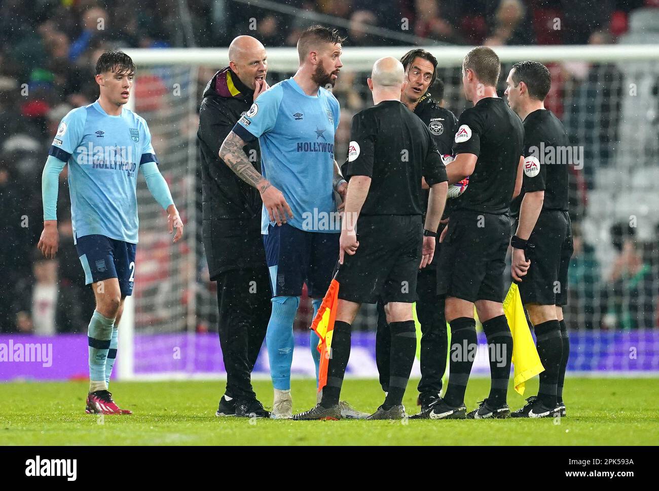 Brentford manager Thomas Frank (third right) speaks to referee John Brooks (second left) and ...