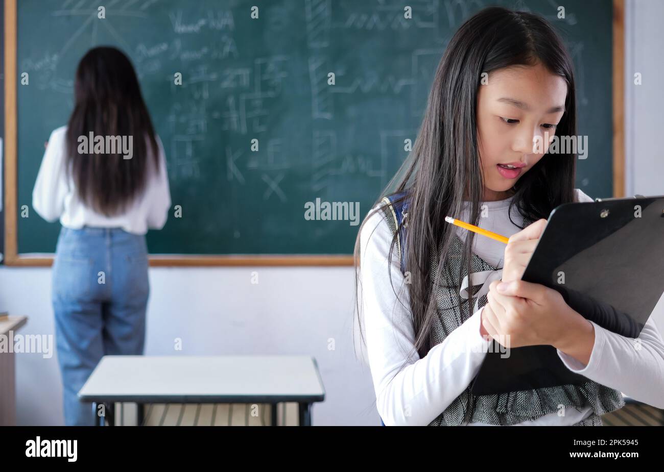 Student studying and reading textbook with happiness in classroom Stock ...