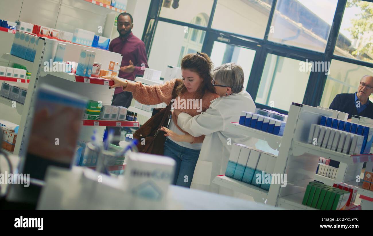Woman losing consciousness and almost fainting near pharmacy shelves ...