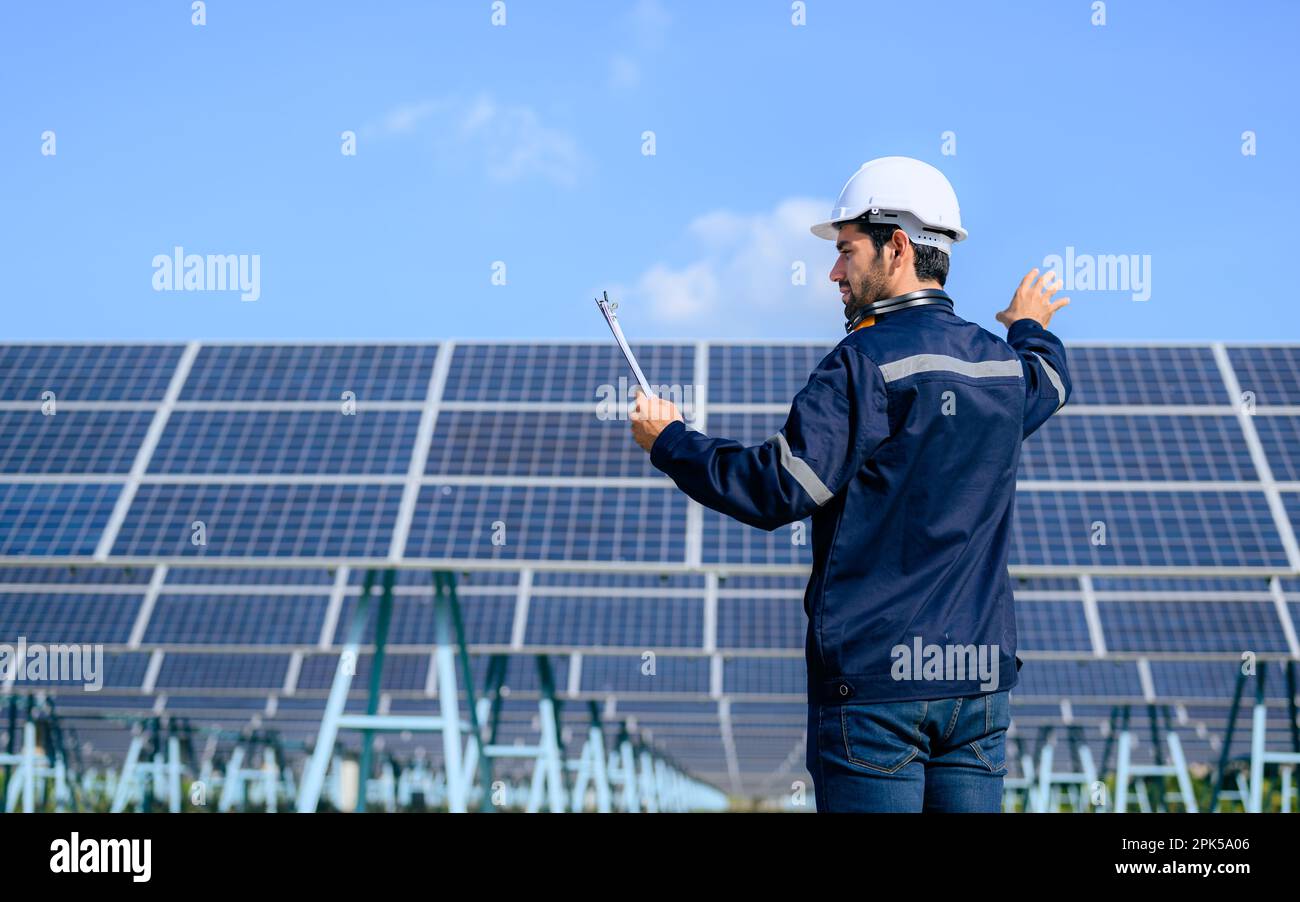 Engineer worker portrait with solar panel at solar farm Stock Photo - Alamy