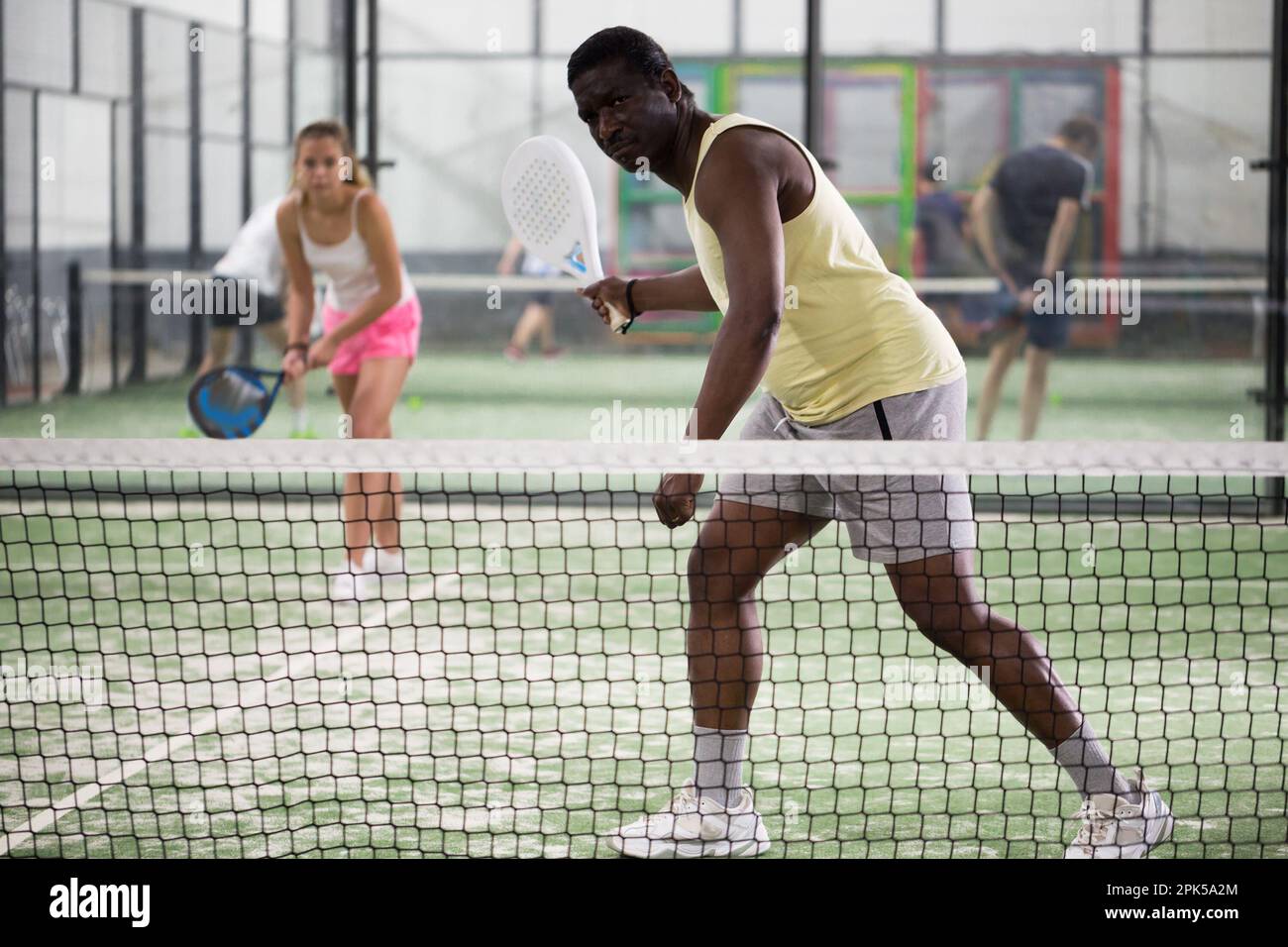 Padel tennis player posing in court closeup Stock Photo - Alamy