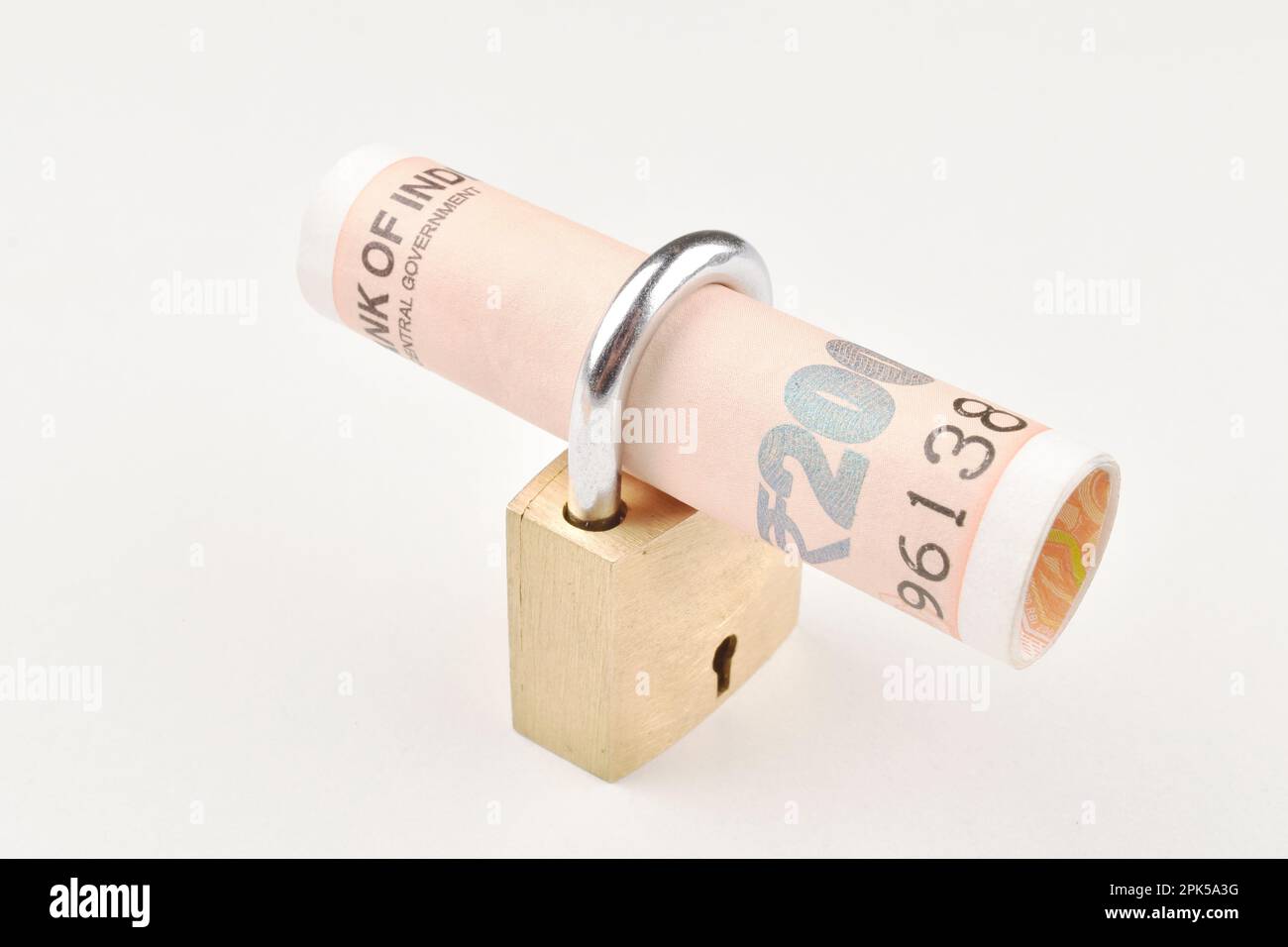 Indian currency note with padlock on white background Stock Photo - Alamy