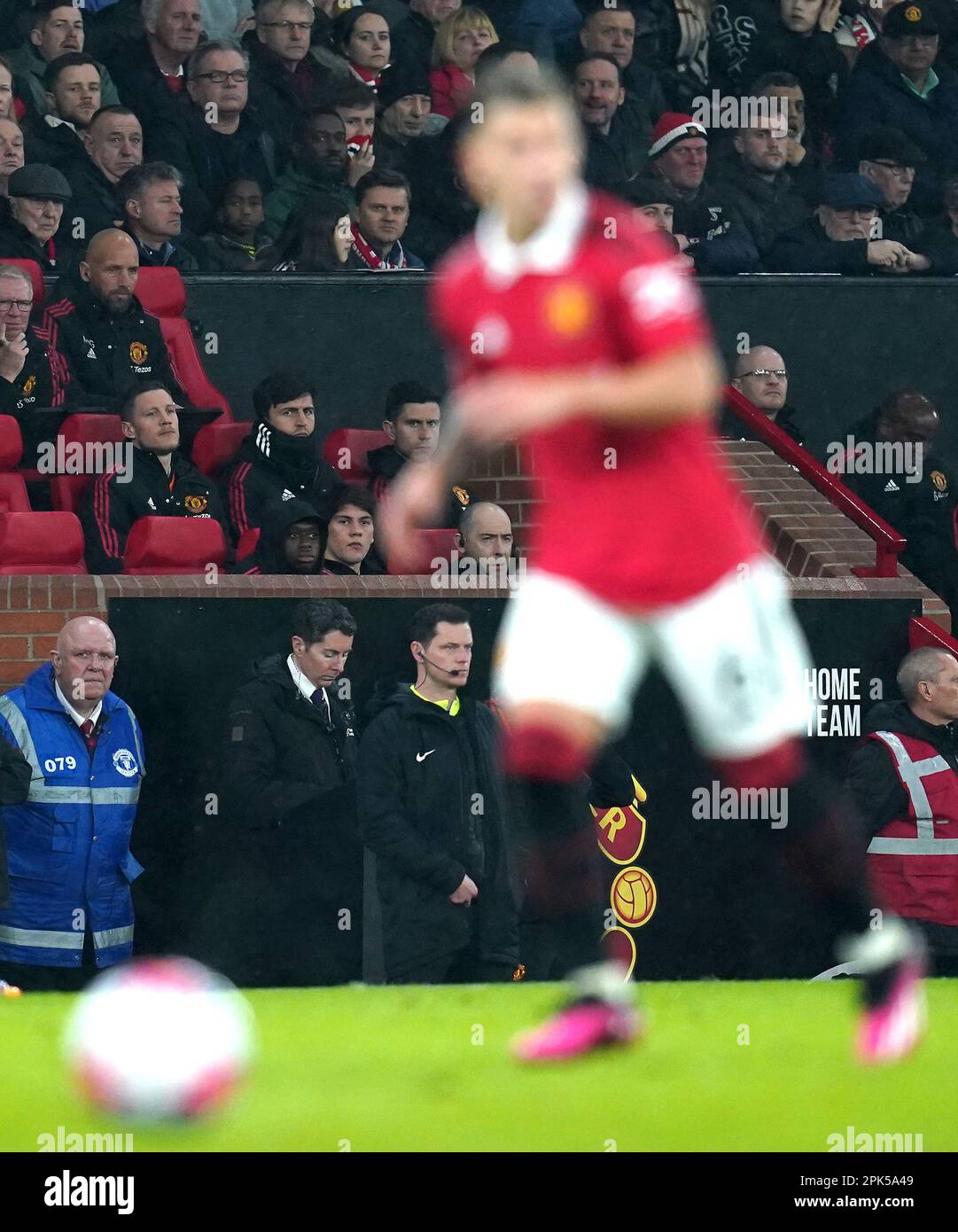 Manchester United's Harry Maguire looks on from the bench as team-mate ...