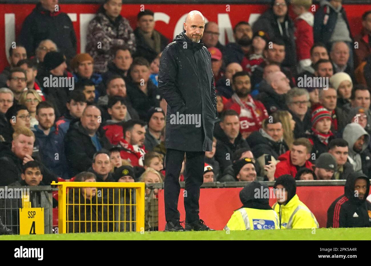 Manchester United manager Erik ten Hag looks on in the rain during the ...