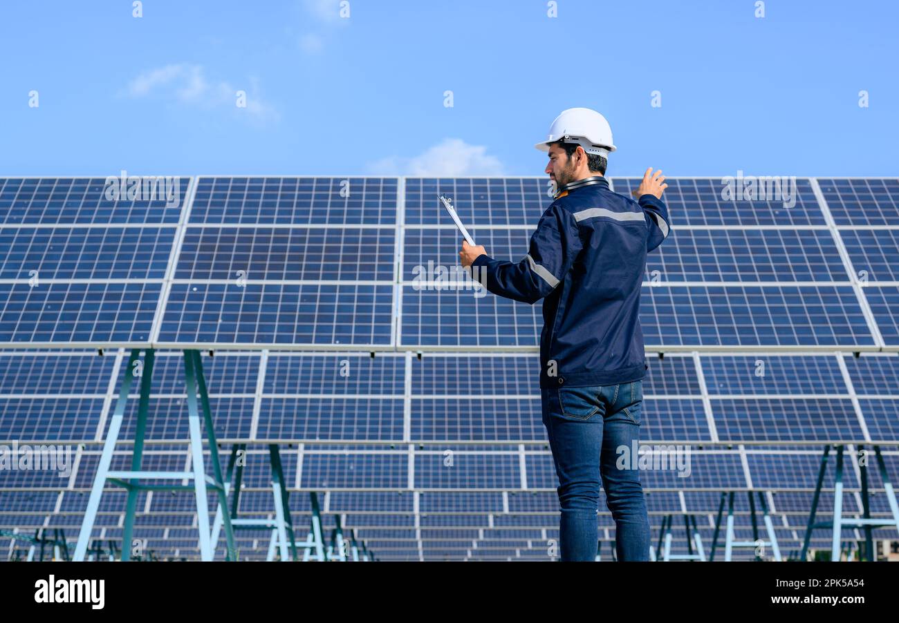 Engineer worker portrait with solar panel at solar farm Stock Photo - Alamy