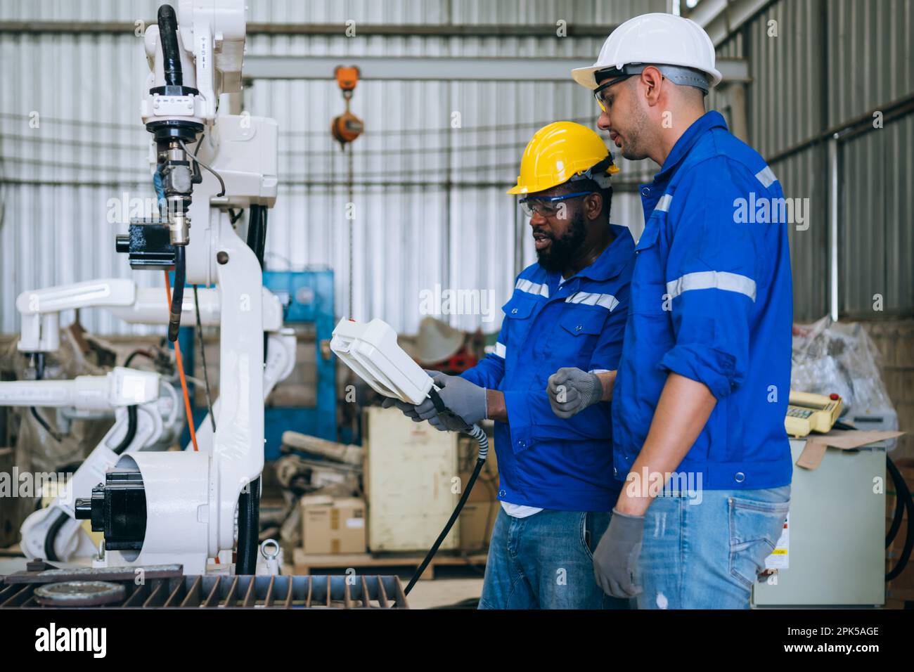 Engineer technician controlling robotic hi-res stock photography and ...