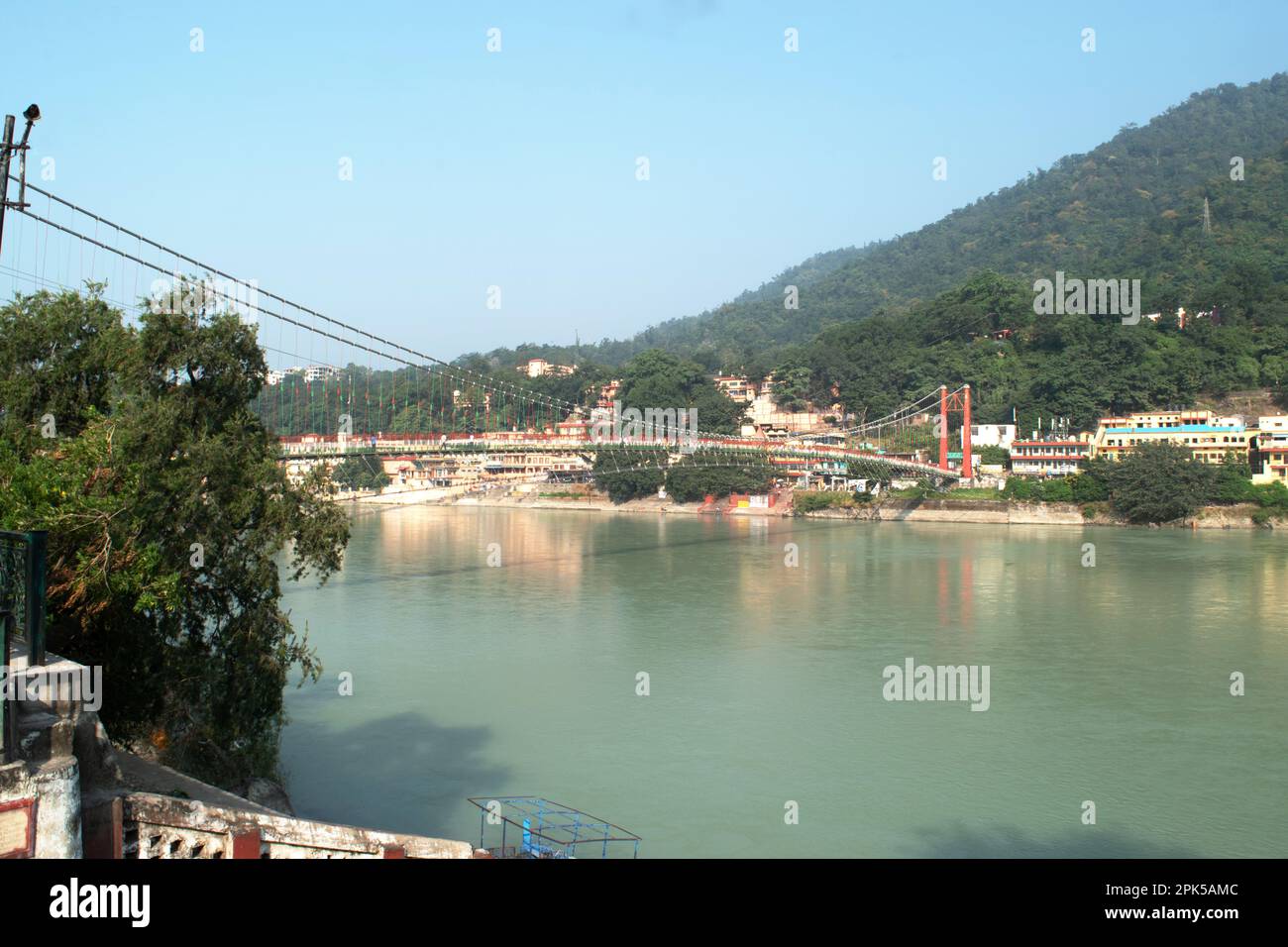 Ram jhula view with ganga river and mountains at rishikesh uttarakhand ...