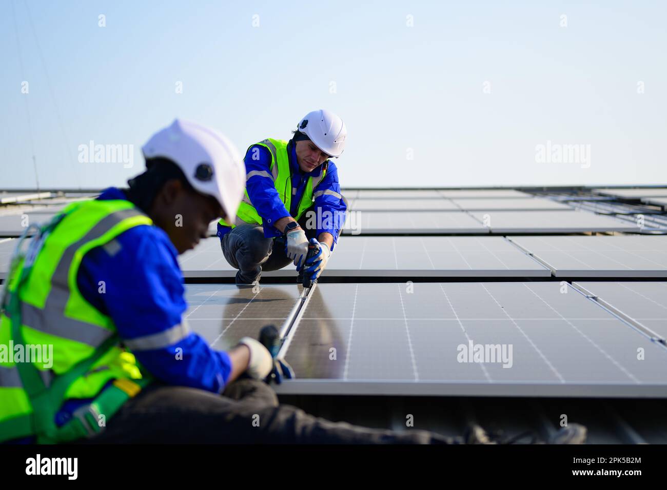 Technicians installing solar panel system hi-res stock photography and ...
