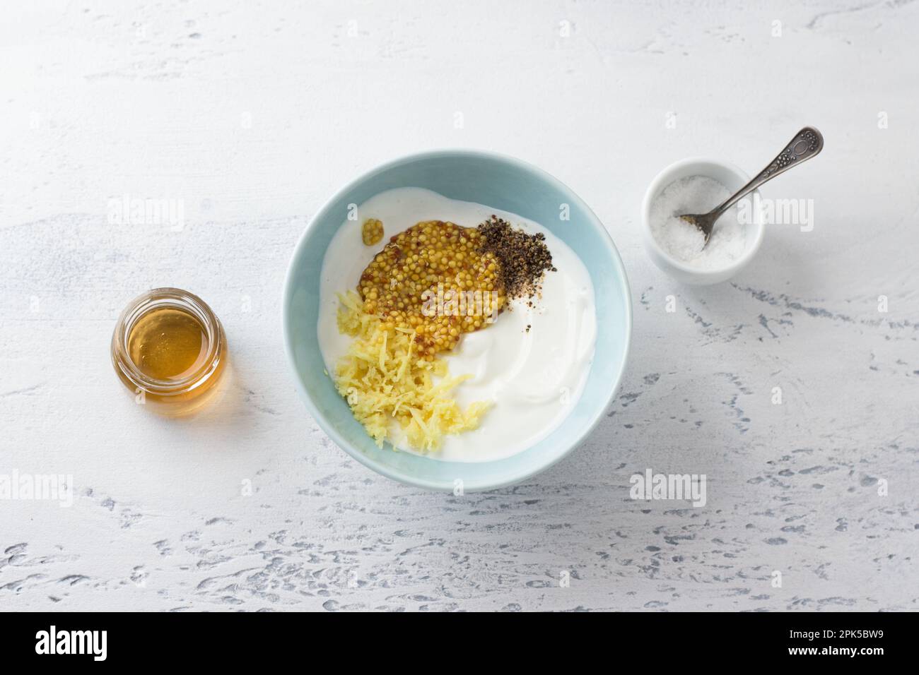 Preparation of salad yogurt dressing with ginger, mustard, black pepper ...