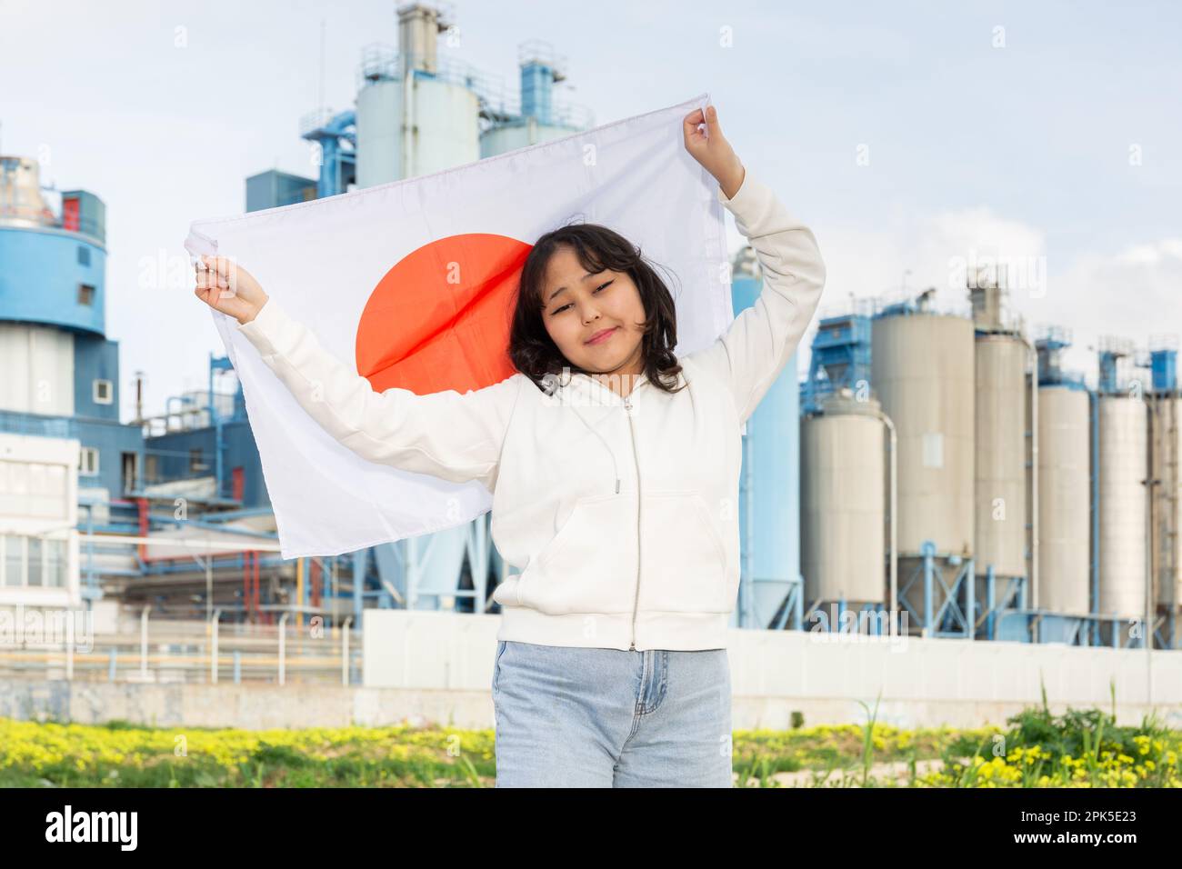 National flag of Japan in hands of girl against background of modern ...
