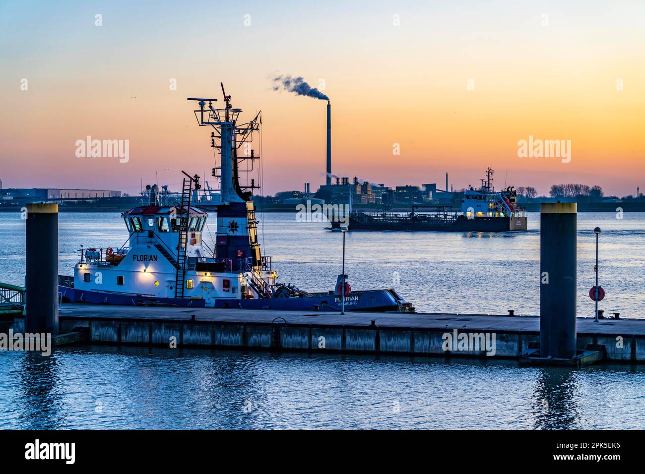 The tugboat pier, harbour tugs waiting for the next assignment, at the New Harbour, sunset over ...