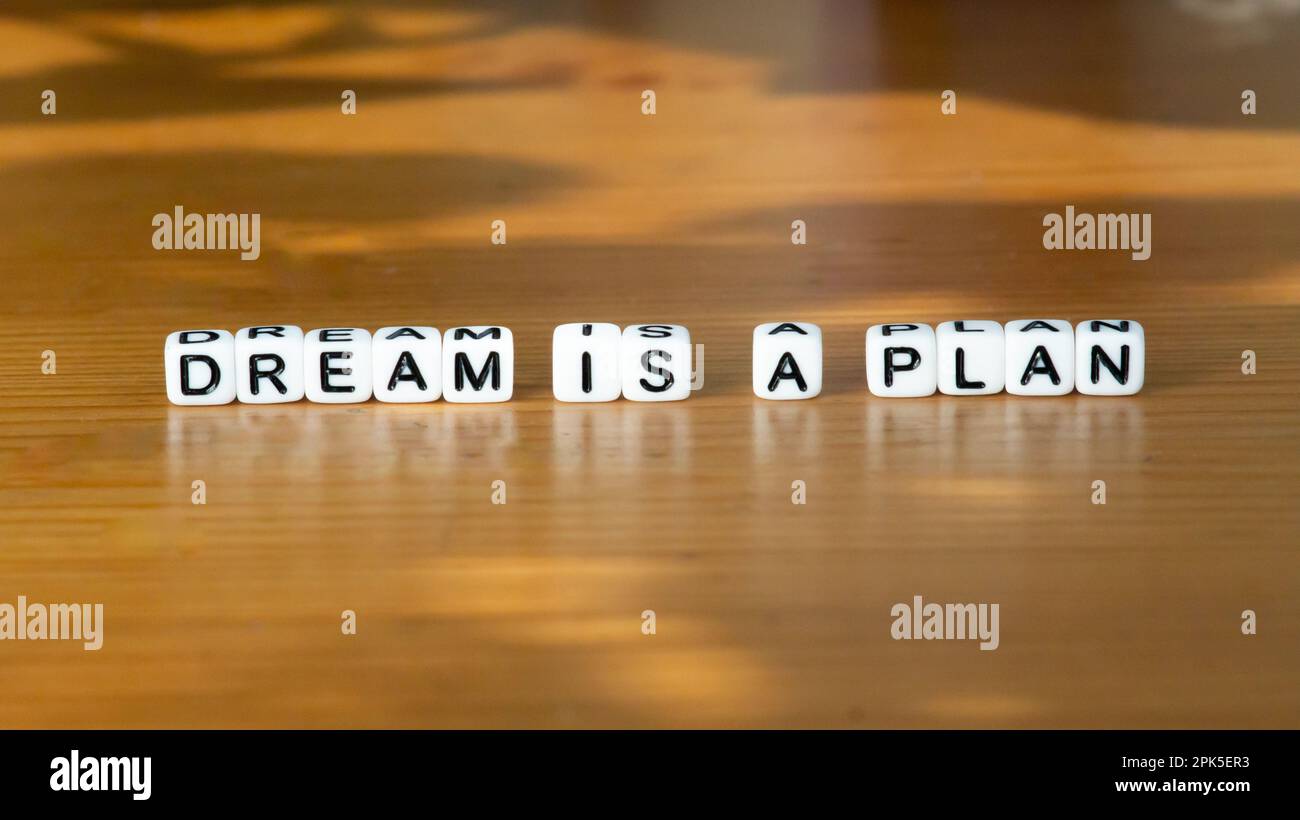 Dream is a plan slogan in white letter beads. motivation inspirational ...