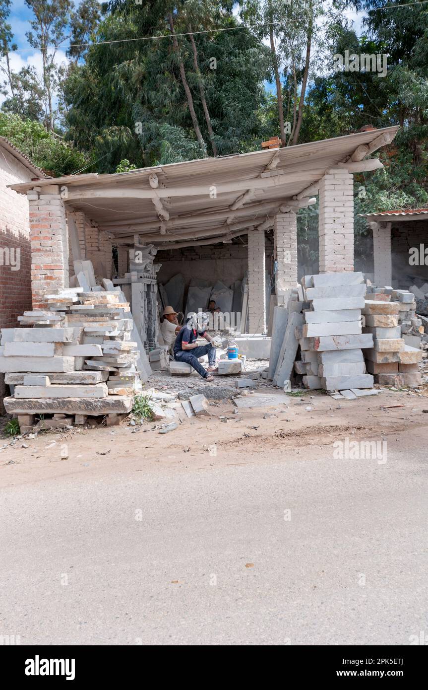 Chinese stone masons working on carving their intricate designs at a ...