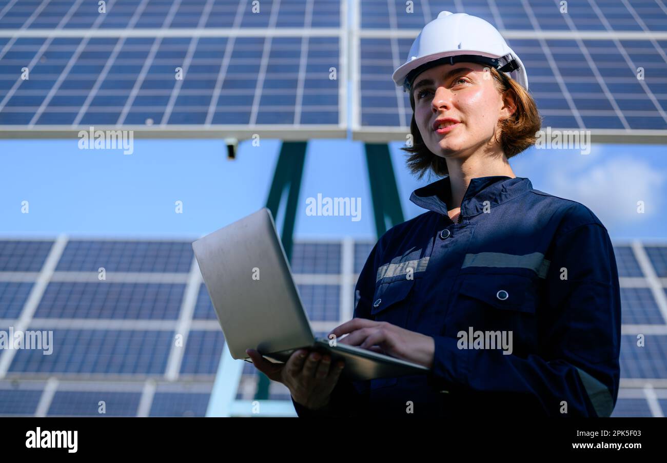 Engineer worker portrait with solar panel at solar farm Stock Photo - Alamy