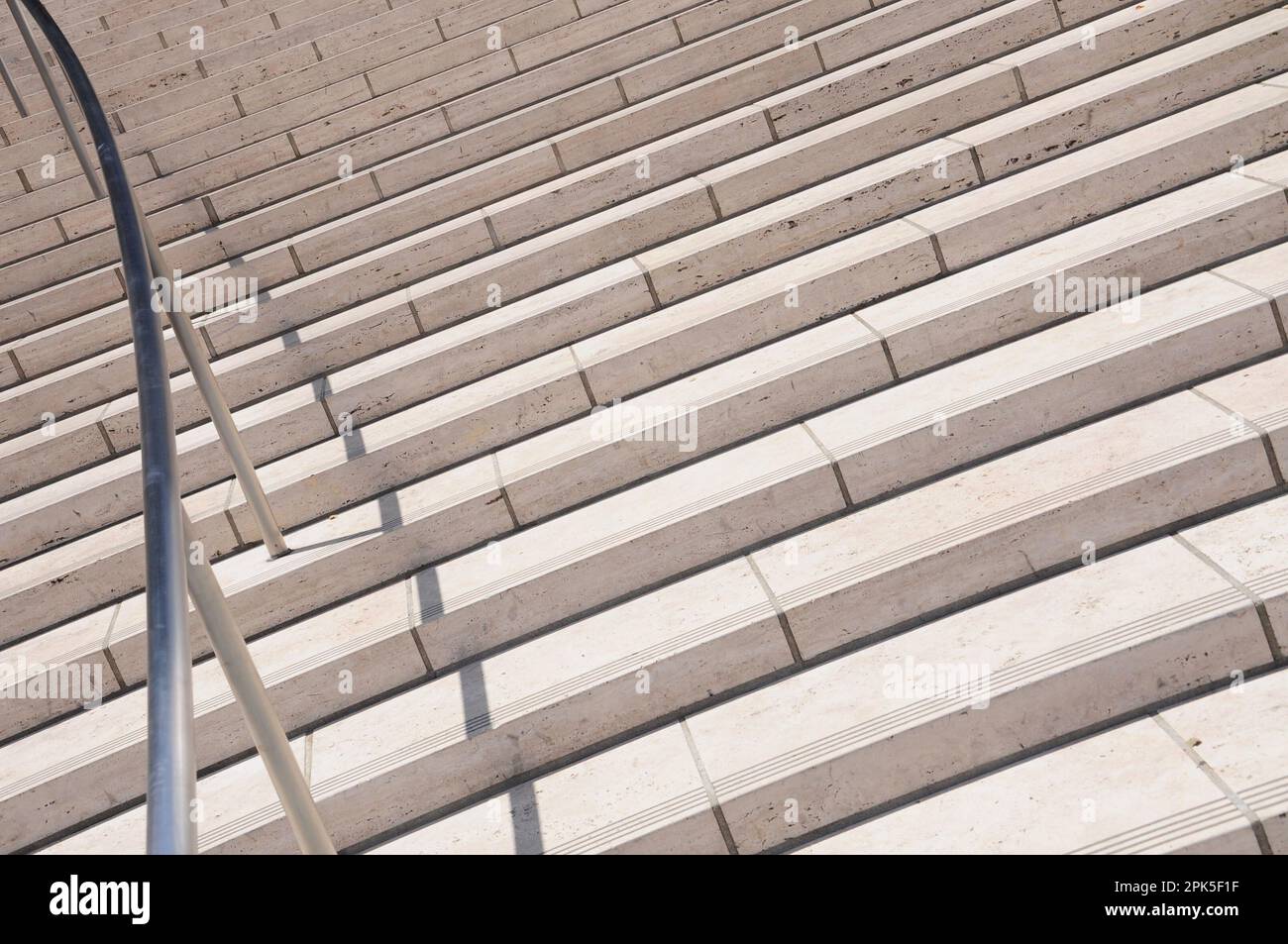 Details of a staircase made of light colored blocks, next to a wall of ...
