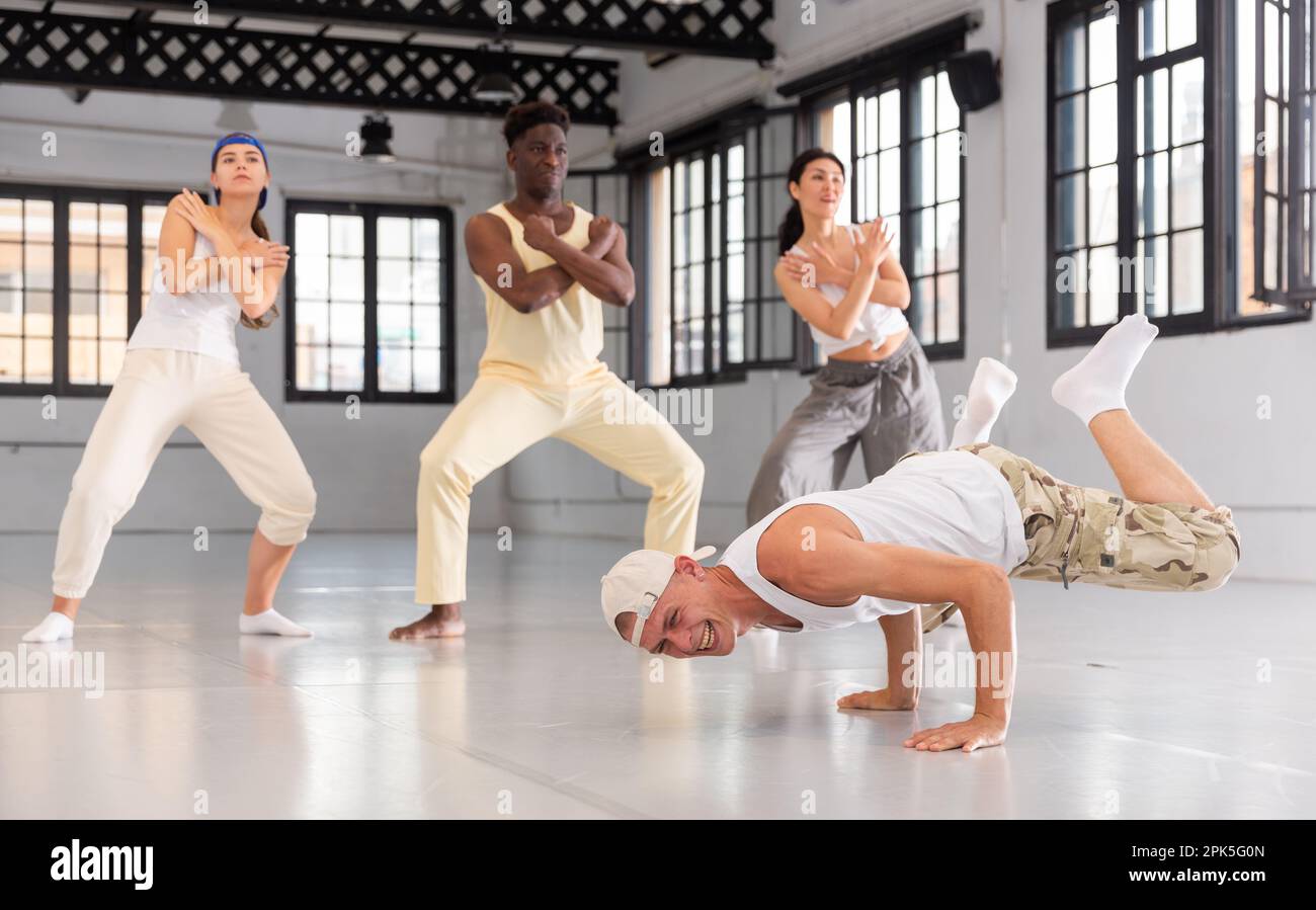 Team of dancers performing hip-hop dance Stock Photo - Alamy