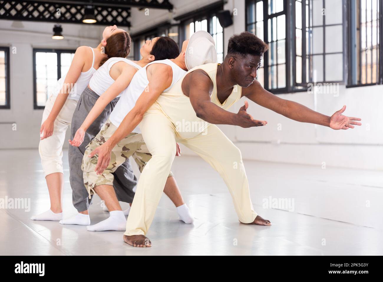 Four artists playing art performance Stock Photo - Alamy