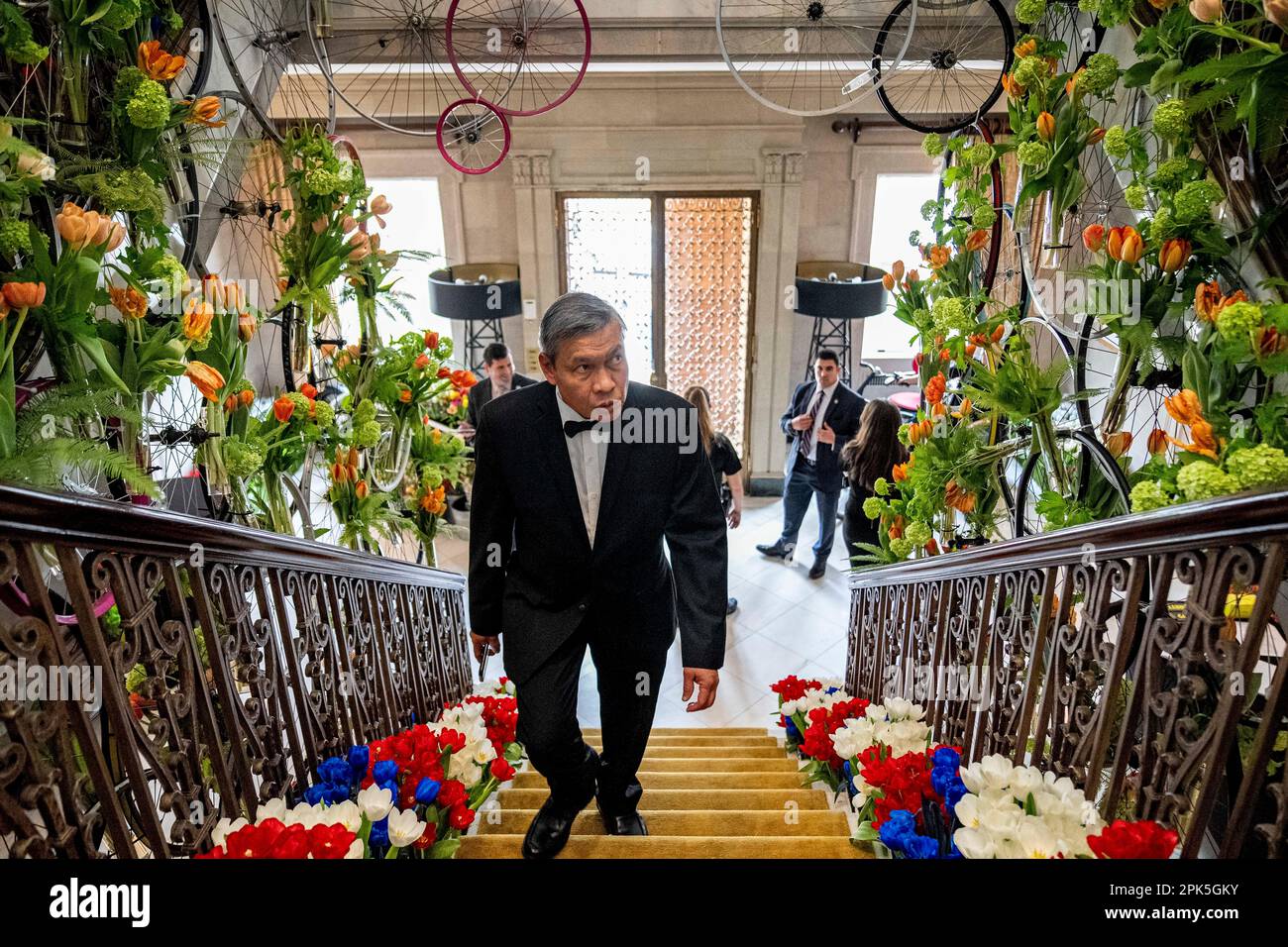 Tulips and bicycle tires are arranged in the foyer before a ceremony ...