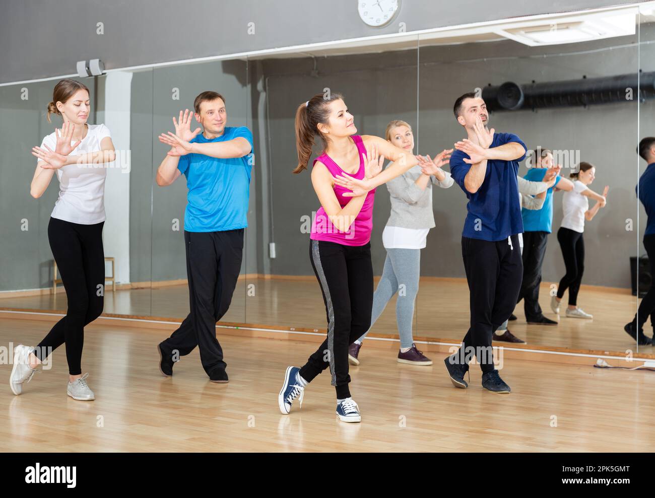 Adult people training in dance studio Stock Photo - Alamy