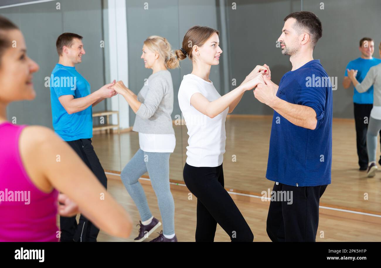 Young couple practicing active dance in pair Stock Photo - Alamy
