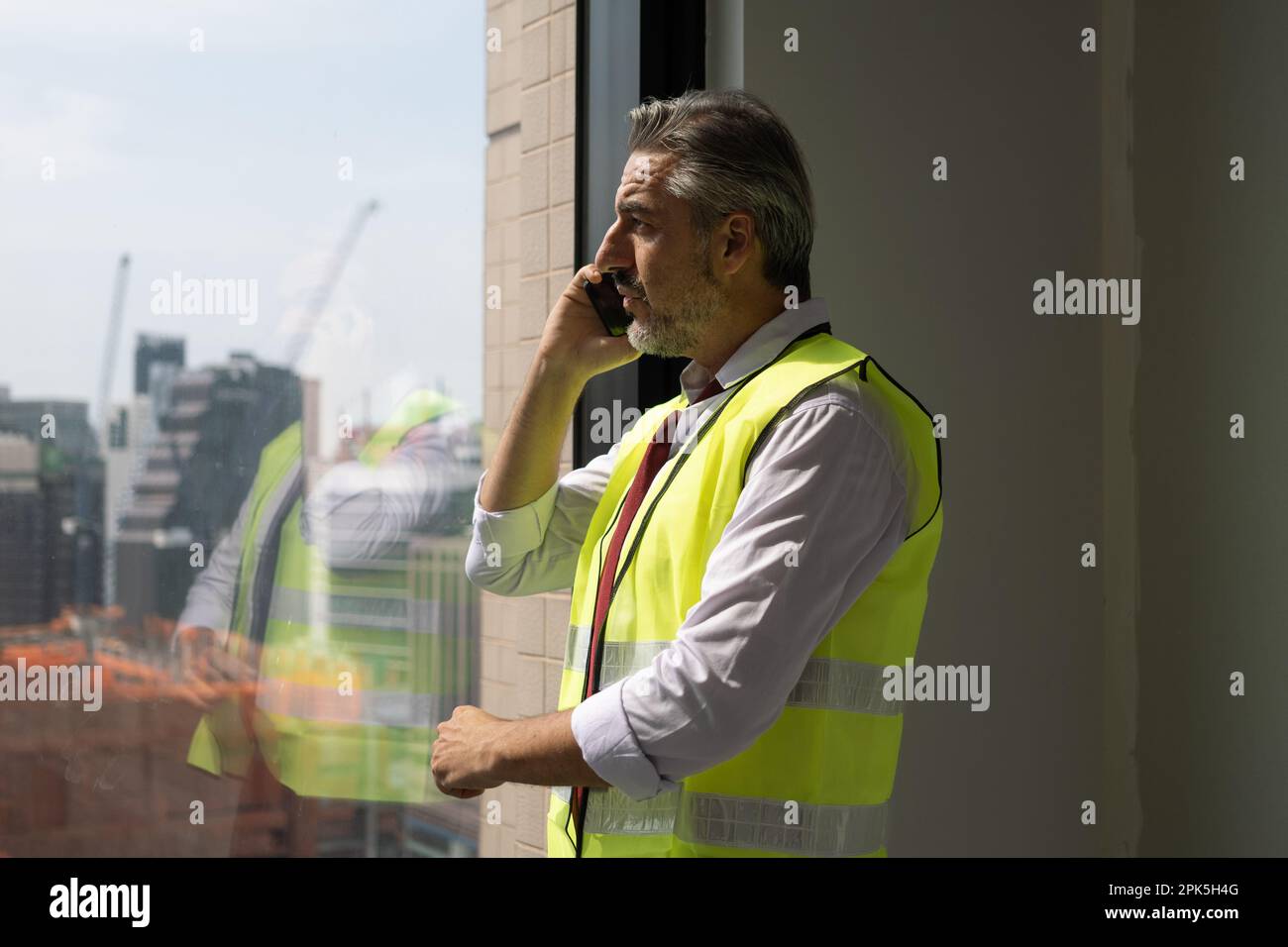 Portrait happy civil engineer talking hi-res stock photography and ...